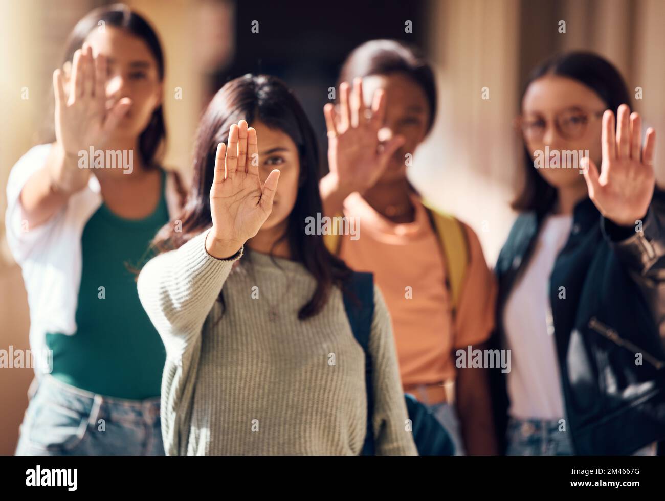 Woman, student and hands in stop for protest, enough or team standing ...