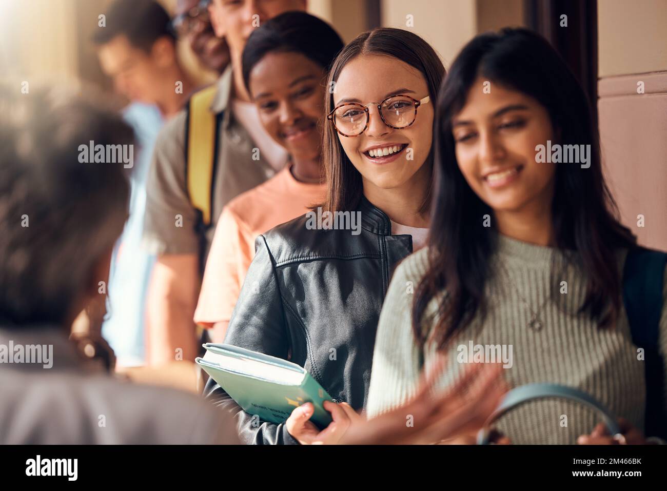 Diversity, students and happy for education, standing in corridor ready ...