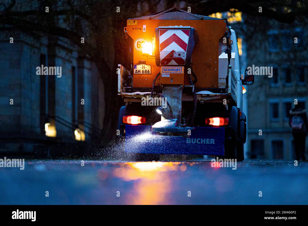 Hanover, Germany. 19th Dec, 2022. A gritting vehicle spreads grit on ...