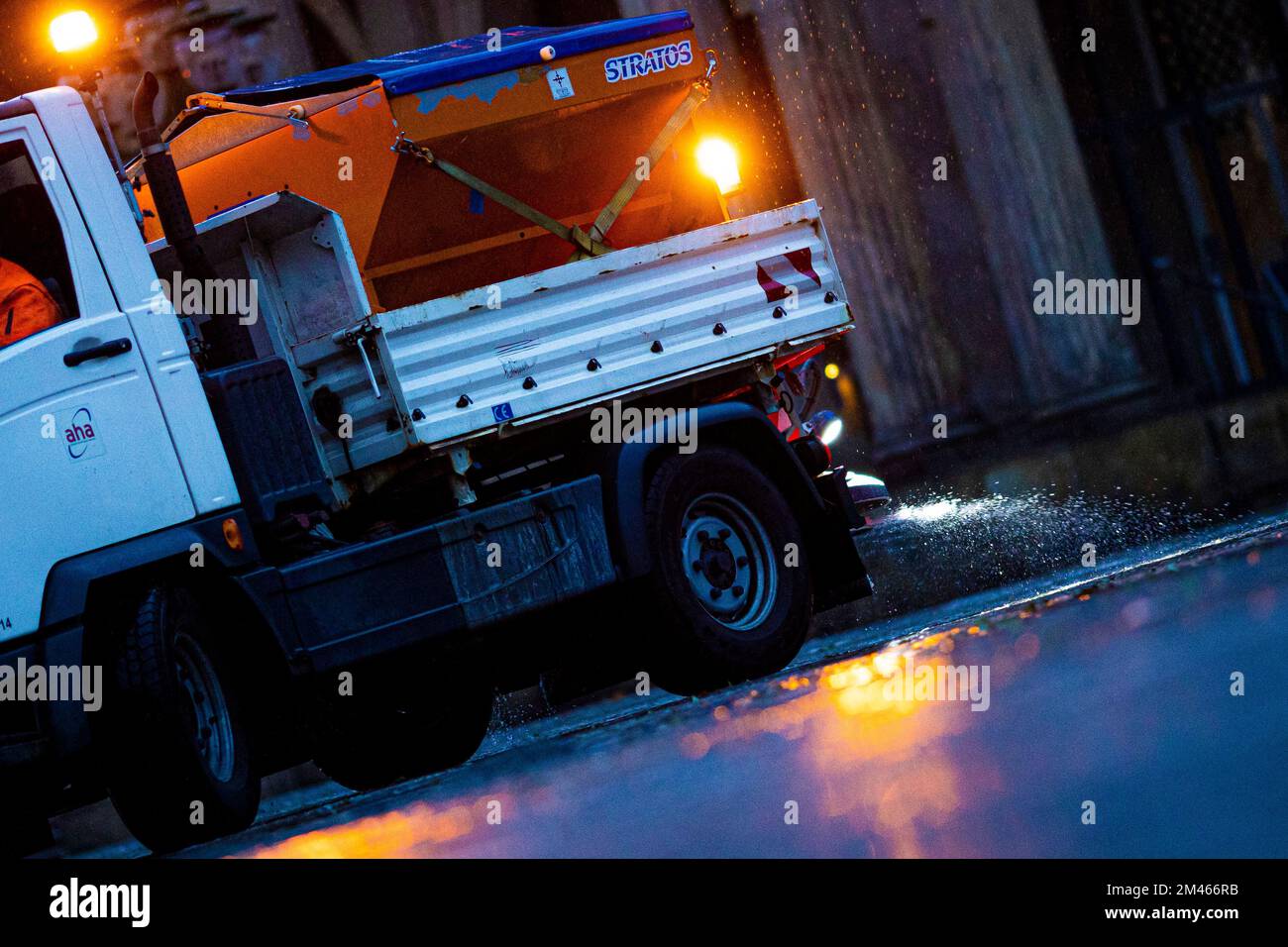 Hanover, Germany. 19th Dec, 2022. A gritting vehicle spreads grit on ...