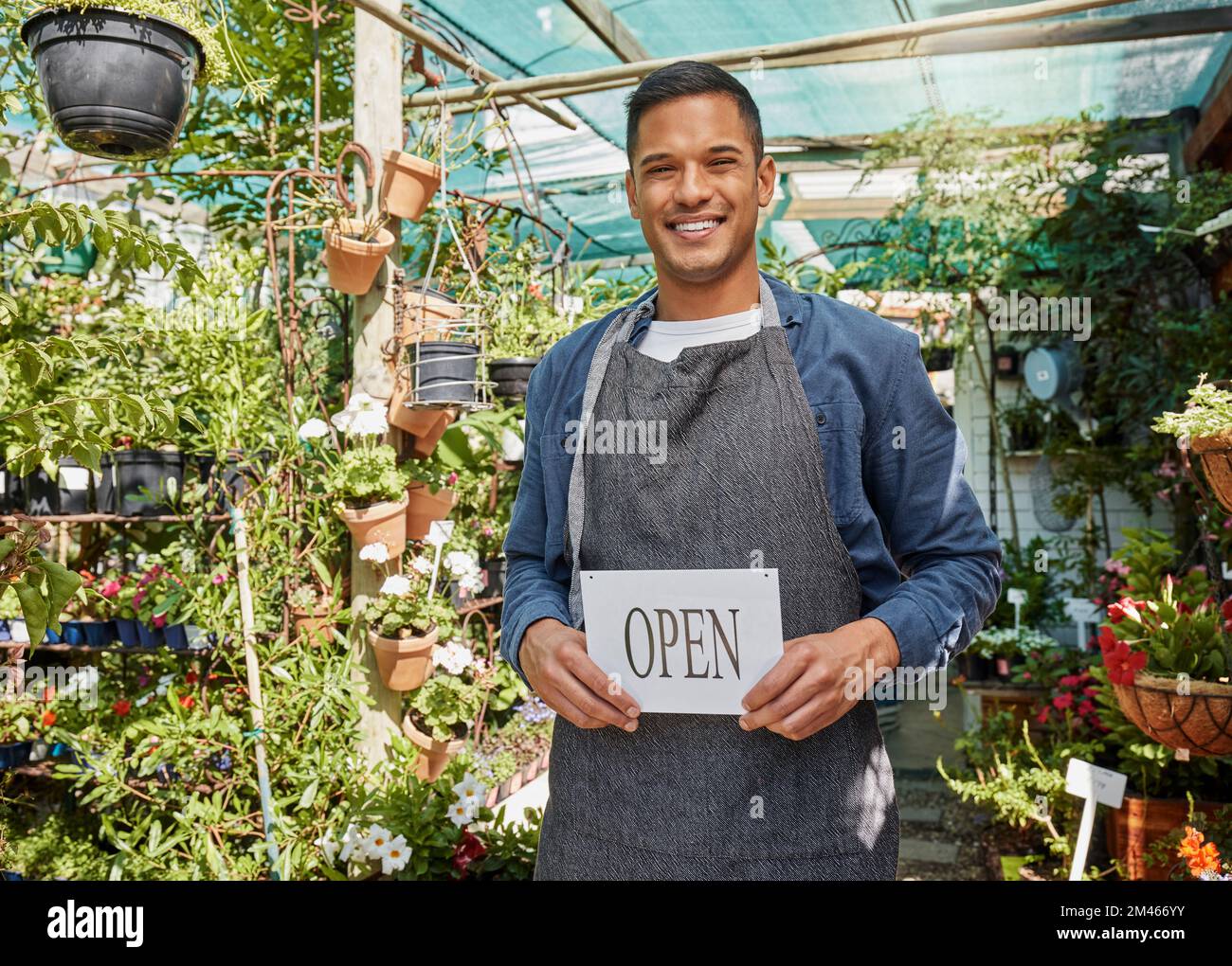 Farmer portrait, plant supermarket and open sign ready for business ...