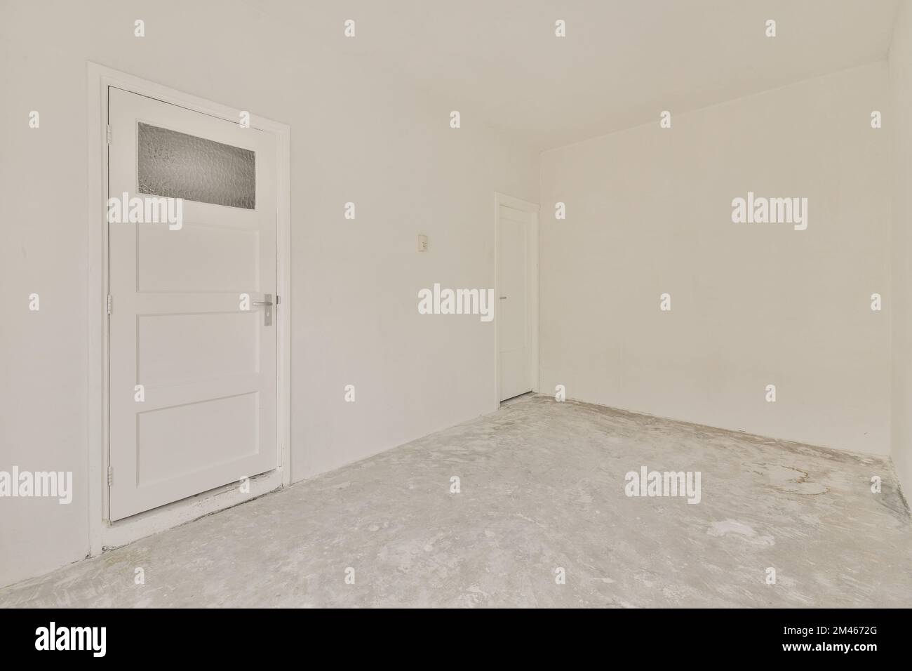 Plastic window and radiator on white wall in empty light room at home ...