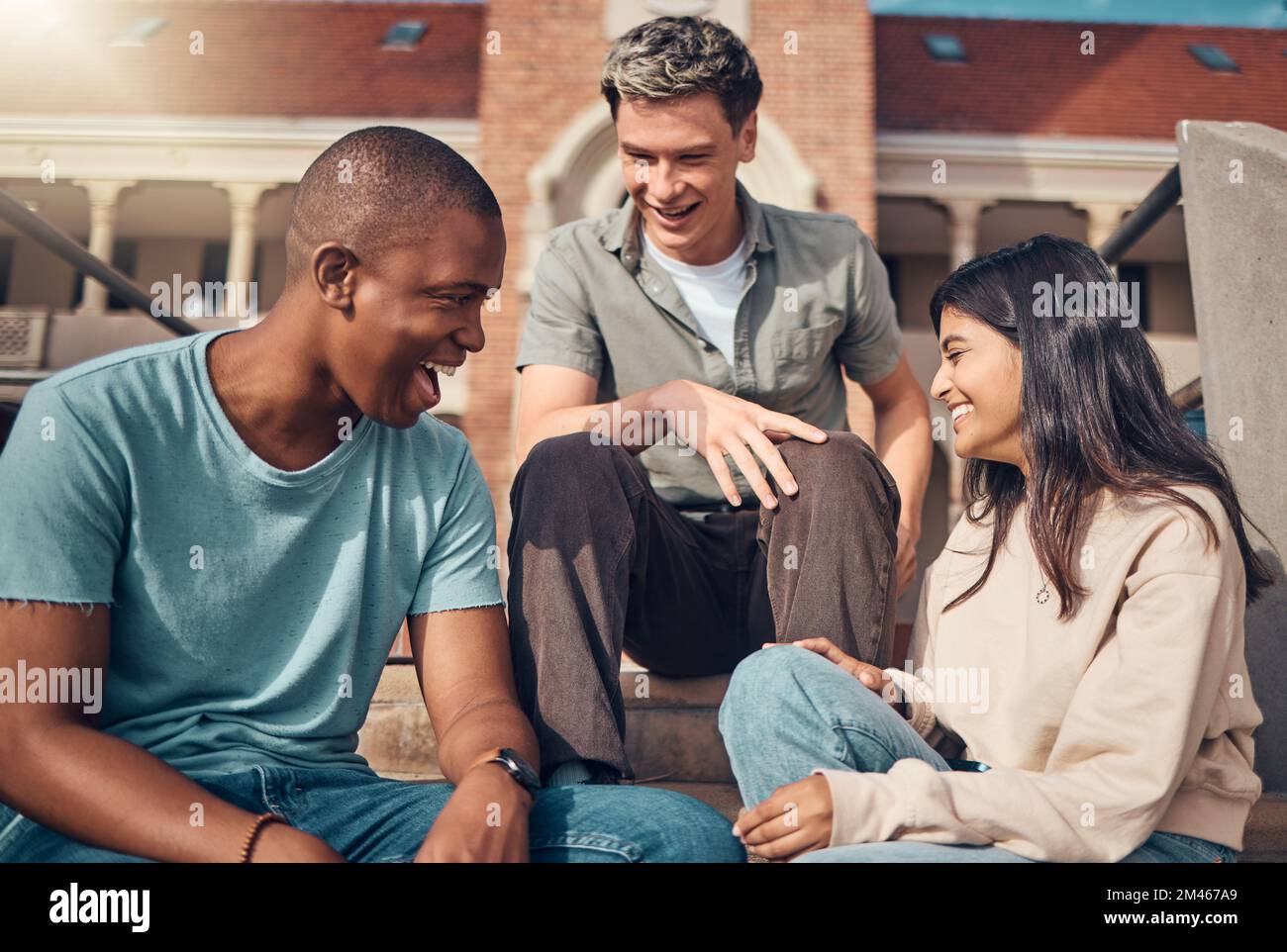 University, students and diversity friends laughing at campus building outdoor in break ...