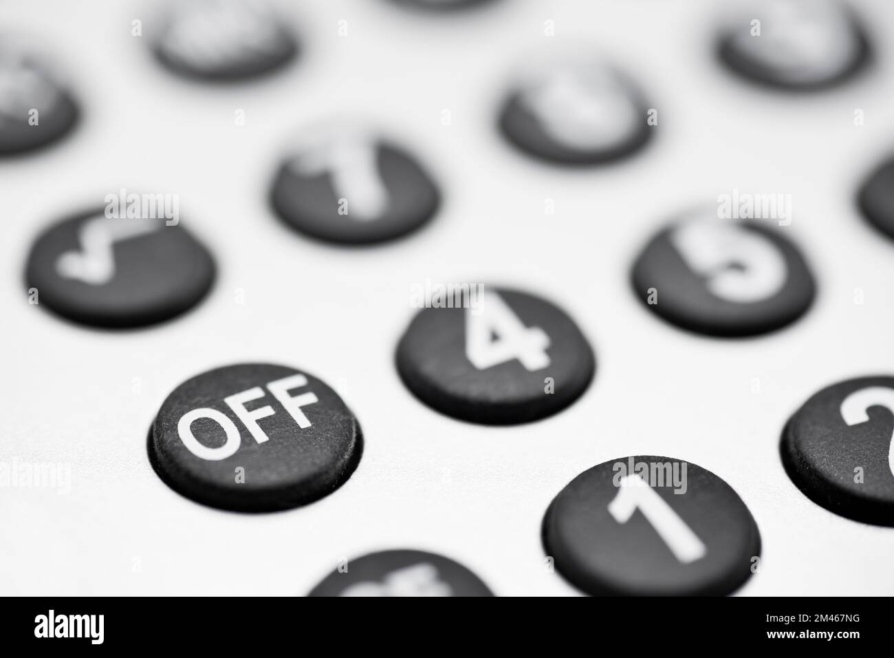 Extreme close-up of buttons of a calculator - focus on the OFF button ...