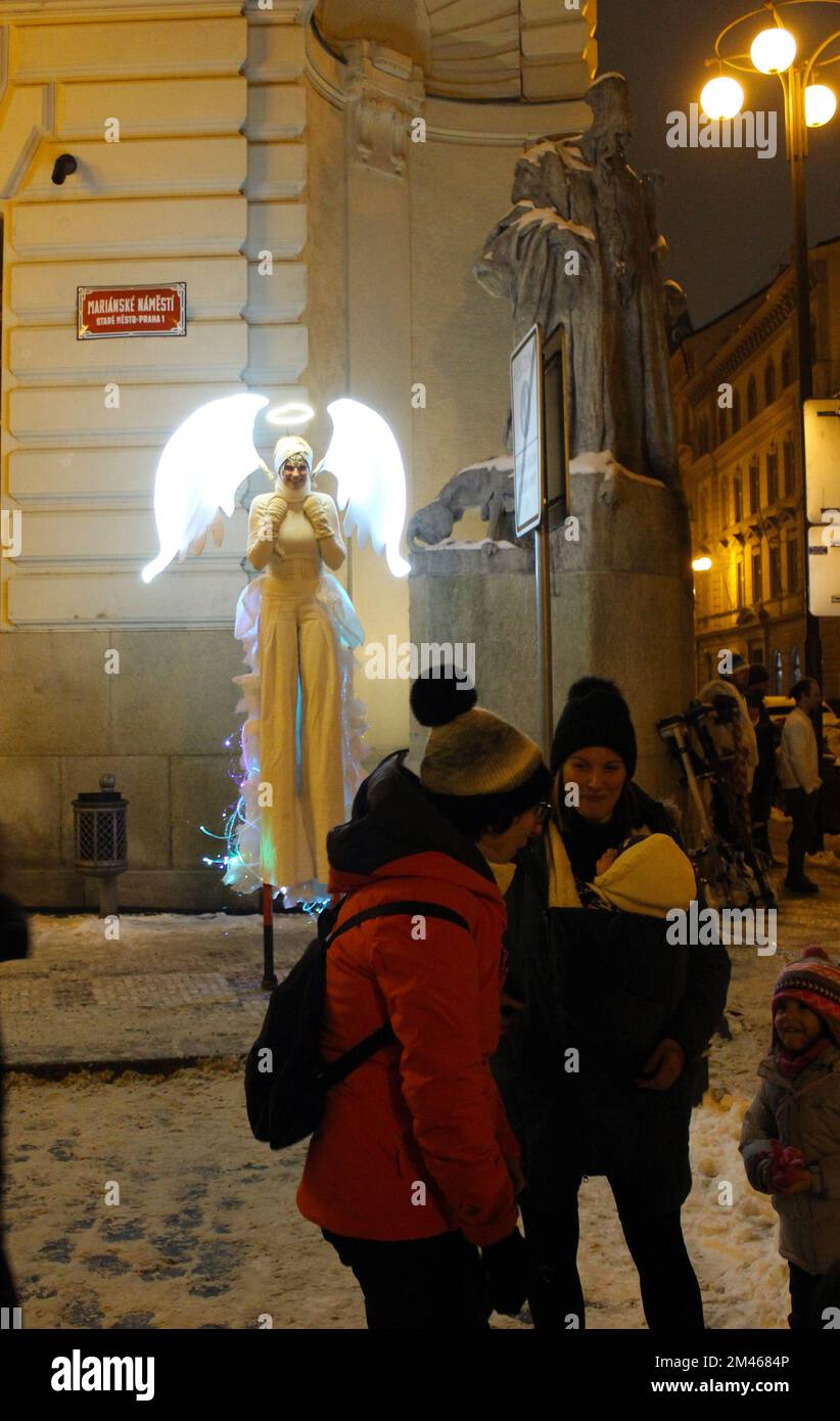 Giant angels on stilts walking in city center of Prague, Czech Republic ...