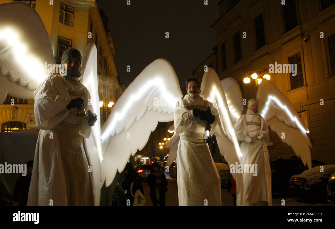 Giant angels on stilts walking in city center of Prague, Czech Republic ...