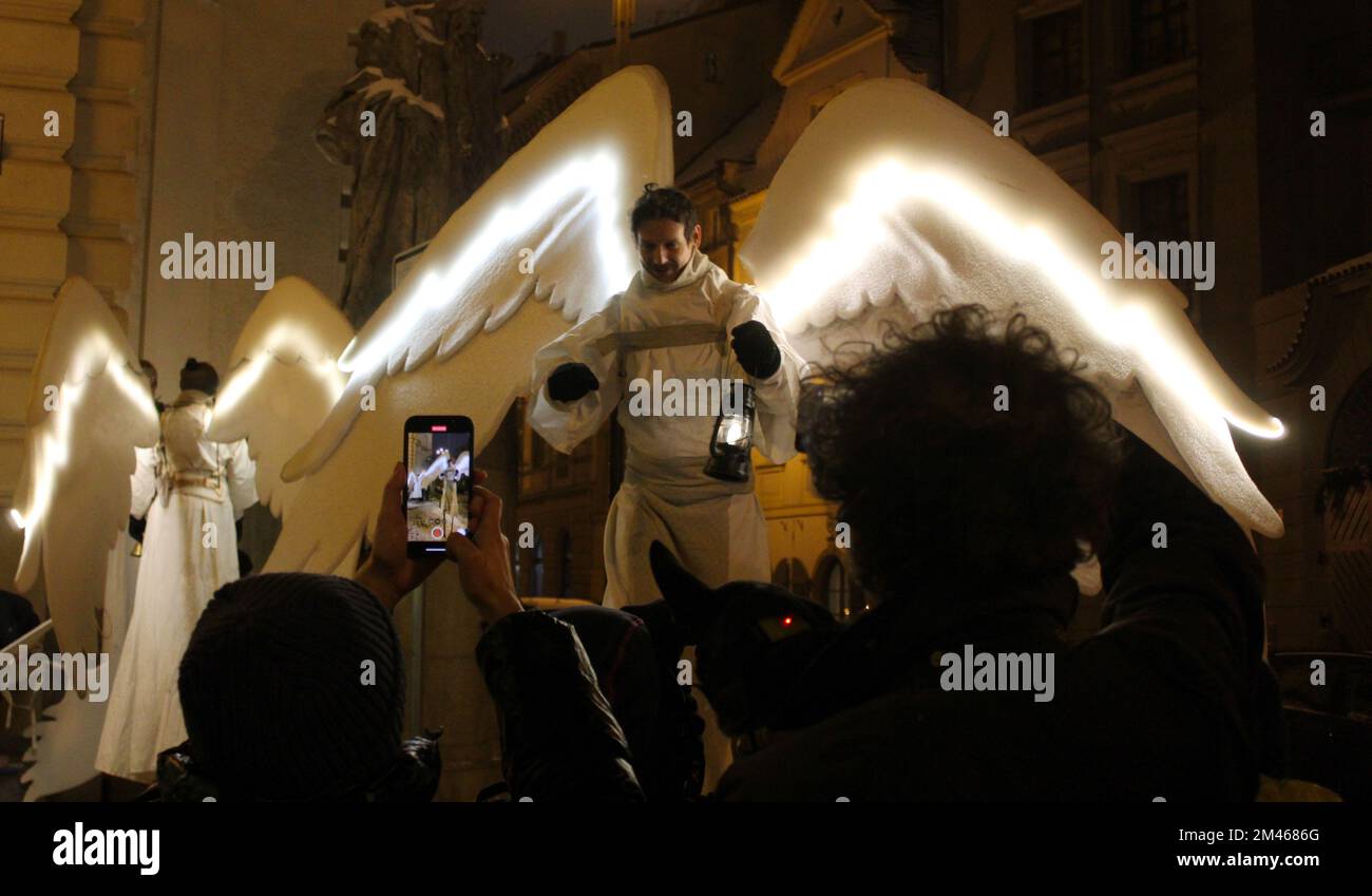 Giant angels on stilts walking in city center of Prague, Czech Republic ...