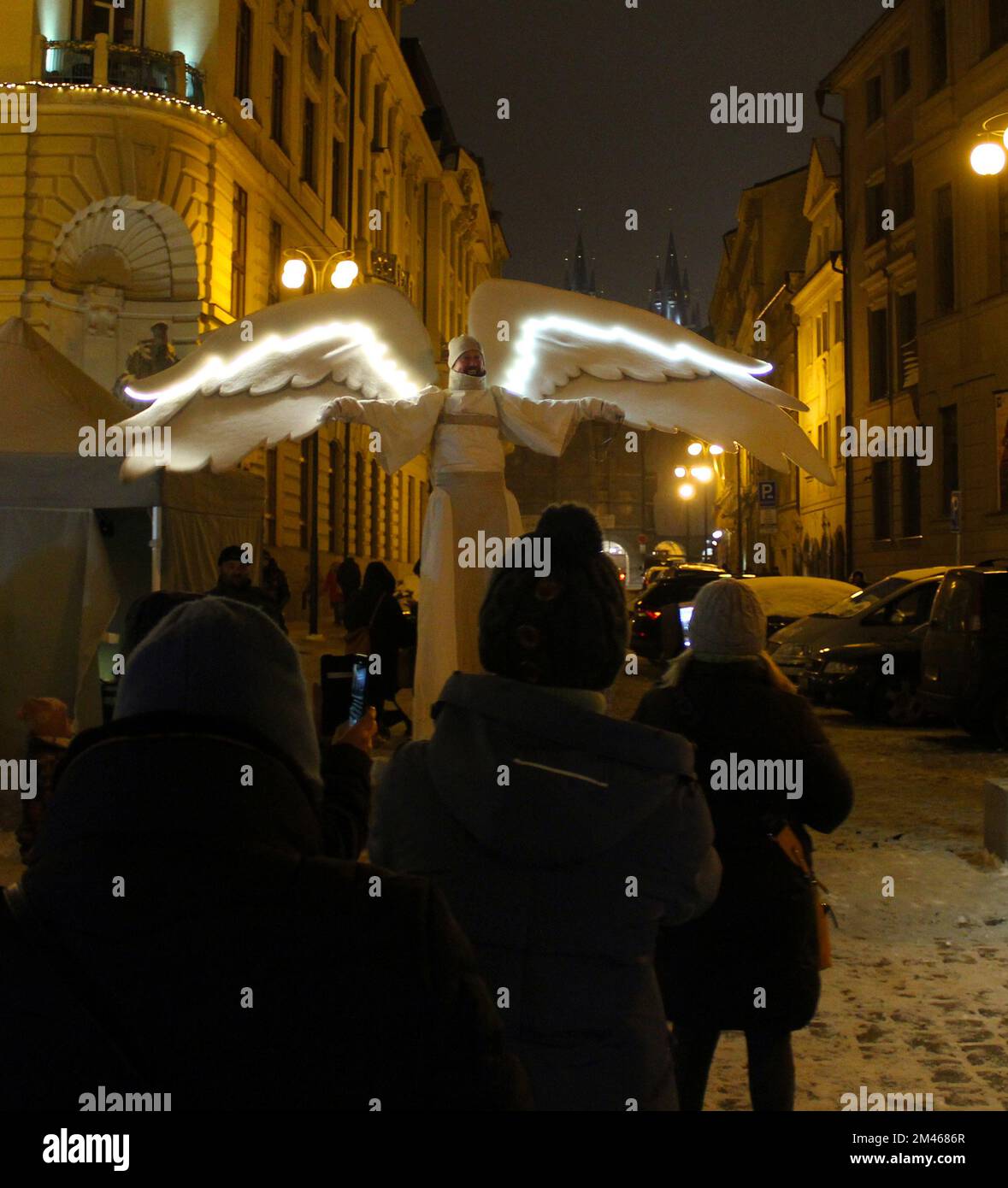 Giant angels on stilts walking in city center of Prague, Czech Republic ...