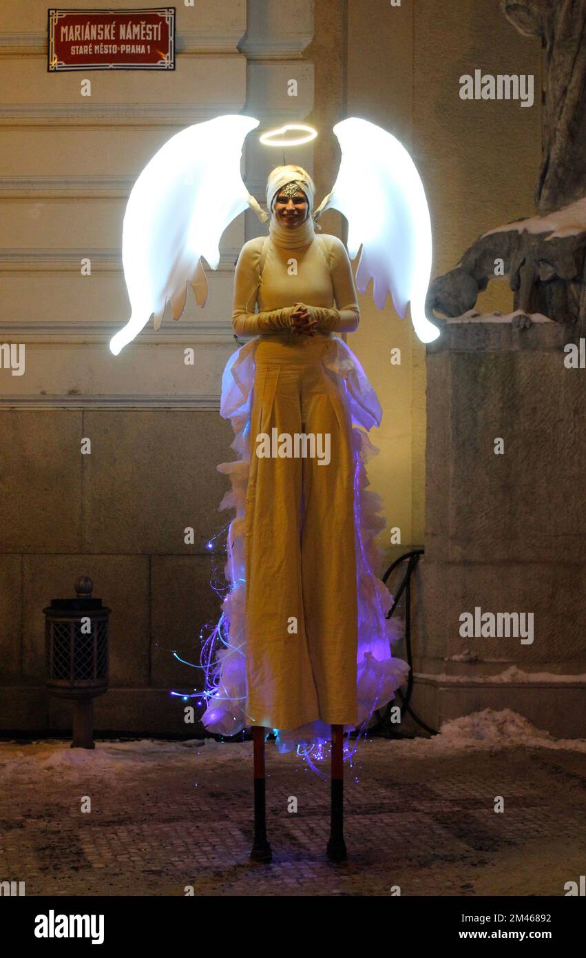 Giant angels on stilts walking in city center of Prague, Czech Republic ...