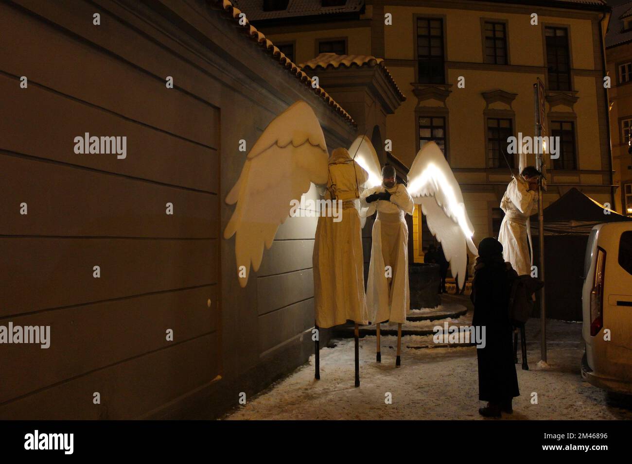 Giant angels on stilts walking in city center of Prague, Czech Republic ...