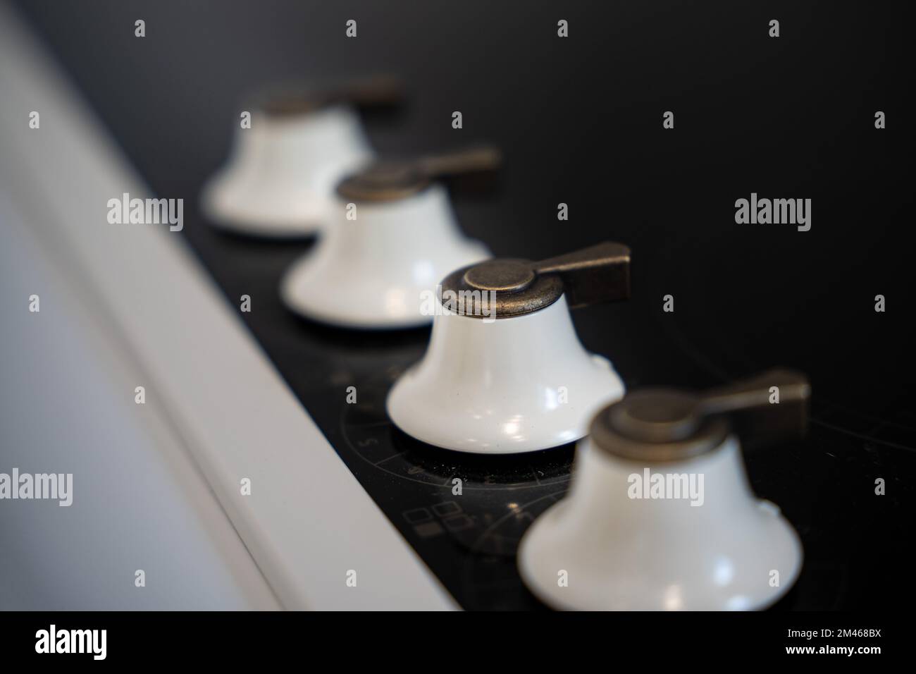 A closeup of handles of oven Stock Photo - Alamy