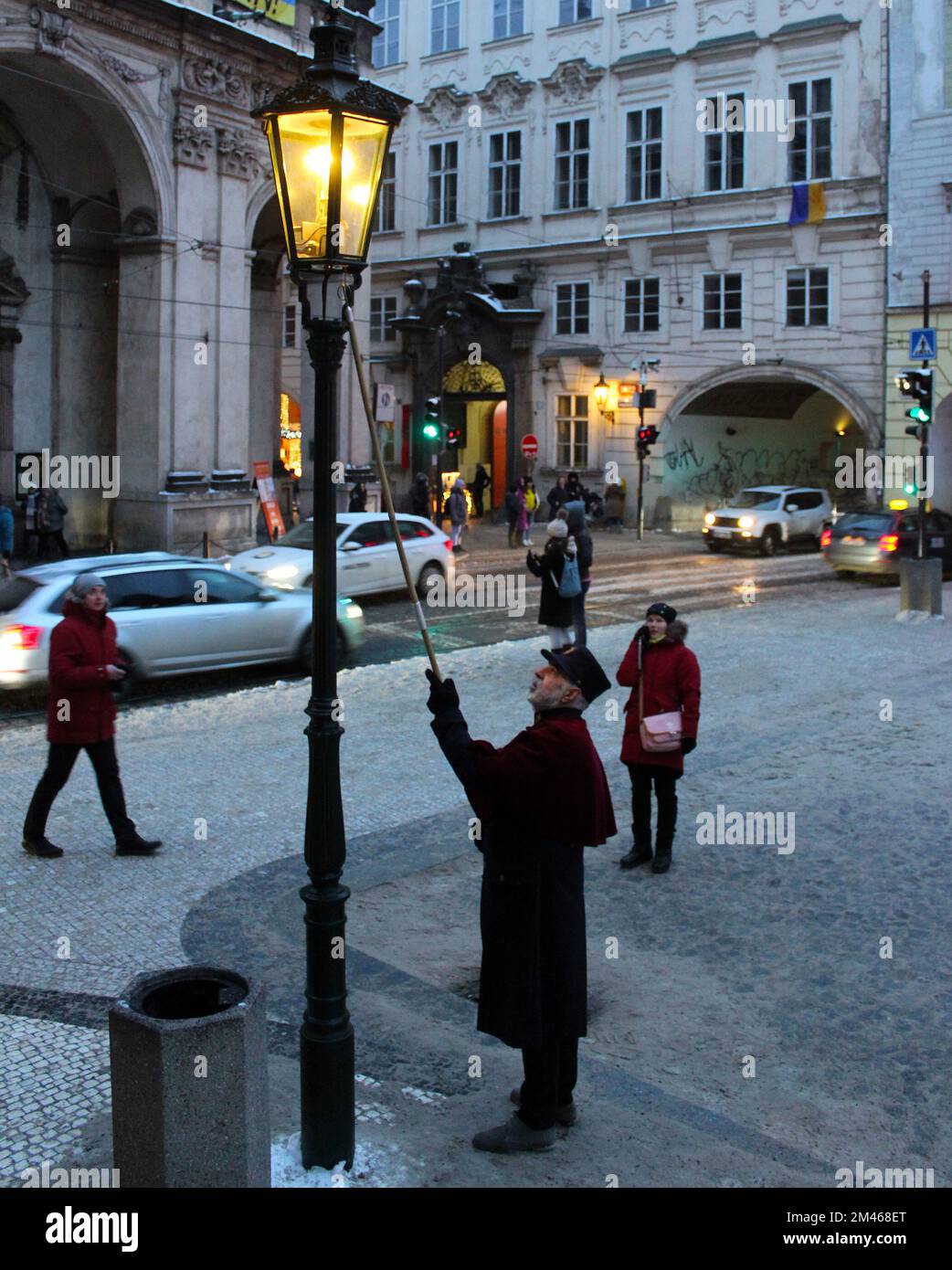 Lamplighter lights up traditional gas lightings on the Charles Bridge ...