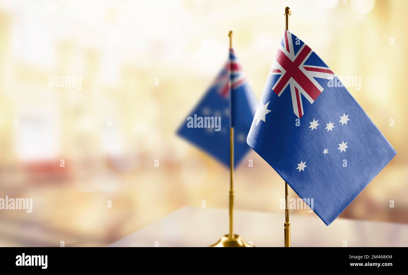 Small flags of the Australia on an abstract blurry background Stock ...