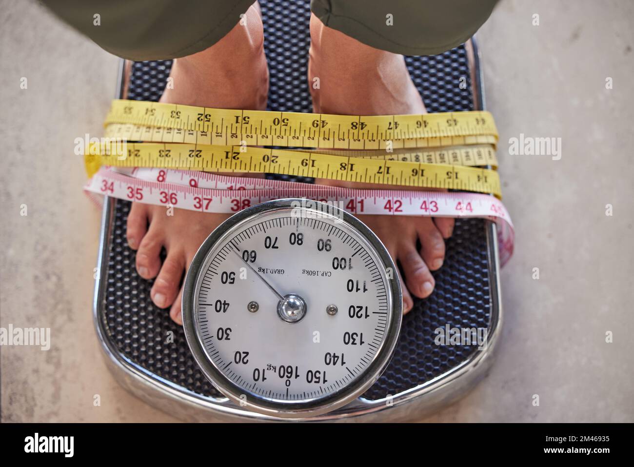 Top view, feet on scale and tape to lose weight, health and diet for ...