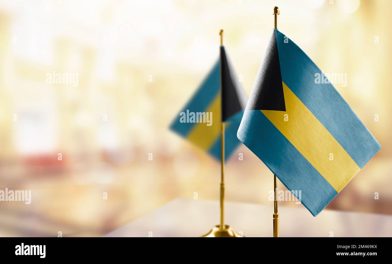 Small flags of the Bahamas on an abstract blurry background Stock Photo ...