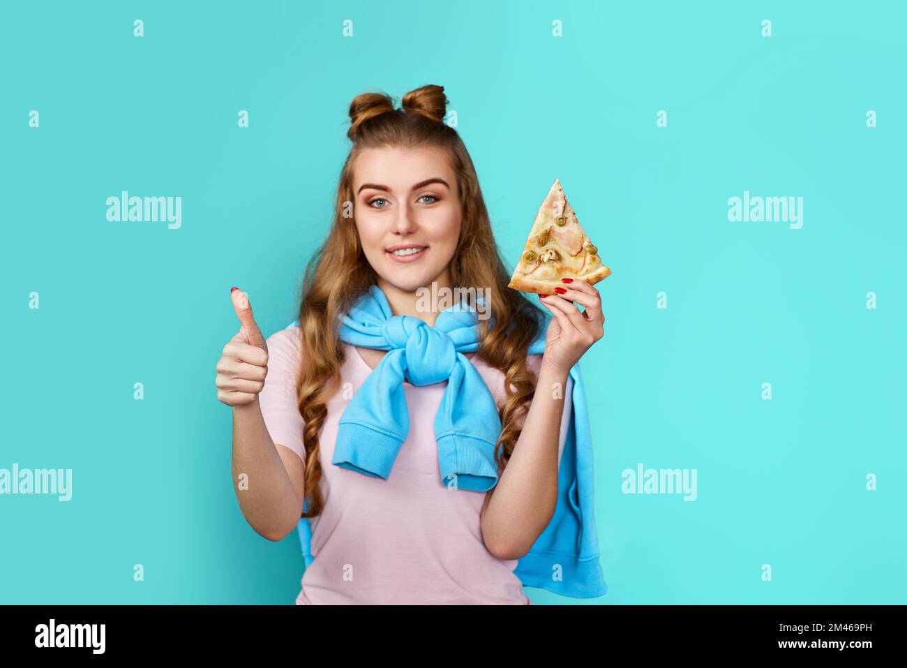 woman eating delicious pizza slice and showing ok gesture Stock Photo ...