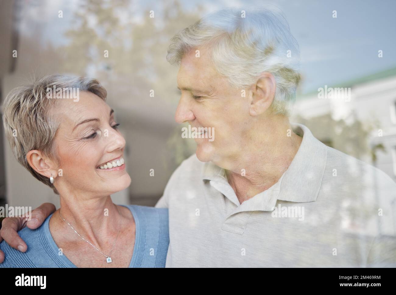Love Hug And Window With Senior Couple Smile And Retirement For