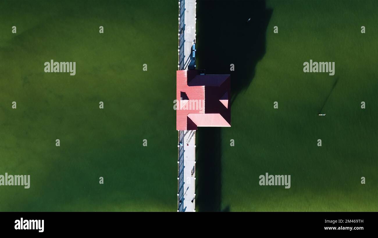 An aerial view of bridge with building over lake Stock Photo - Alamy