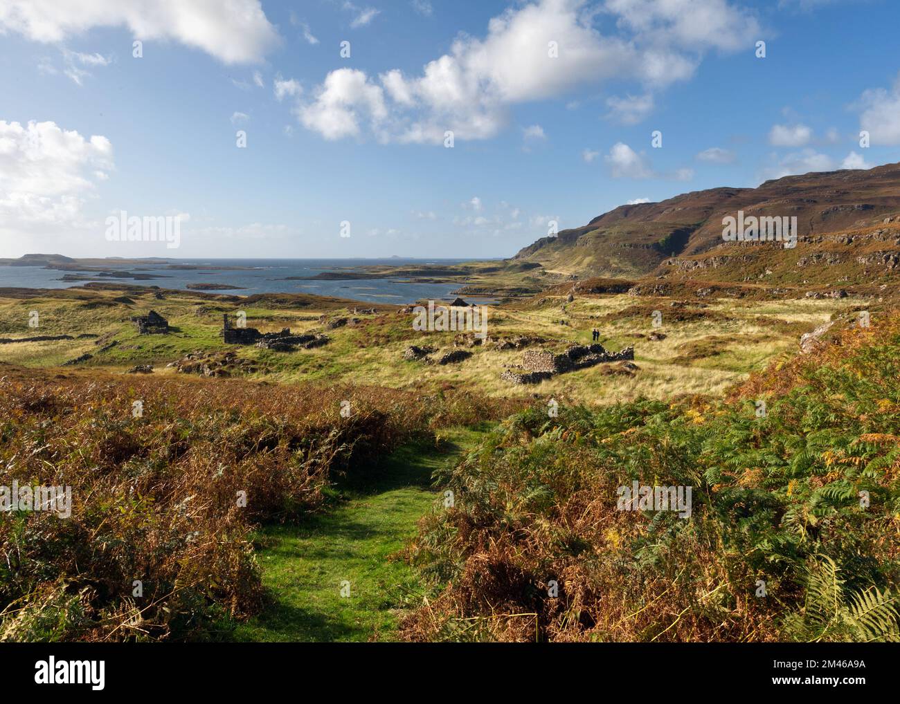 Derelict stone cottages in the abandoned village of Ormaig. Ulva Island ...