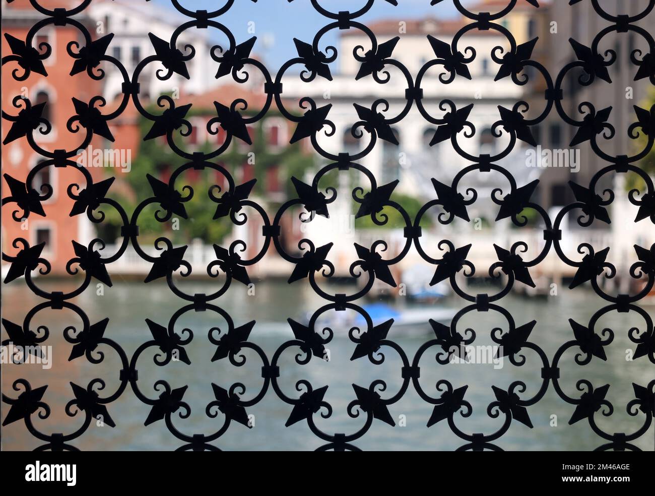 Detail of an ancient window with grating in wrought iron. Venice, Italy ...
