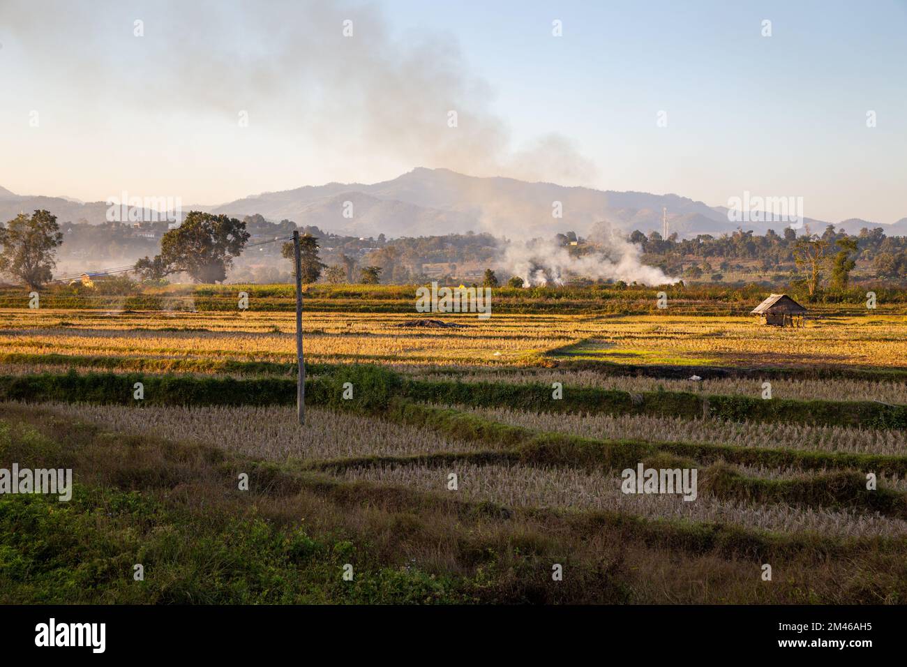 A small fire burns in the middle of rice paddies near Hsipaw in central ...