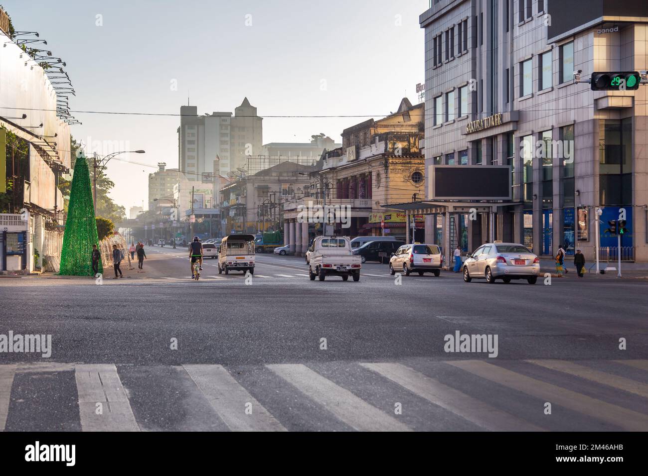 View down a main road through central Yangon, Myanmar, in the early ...