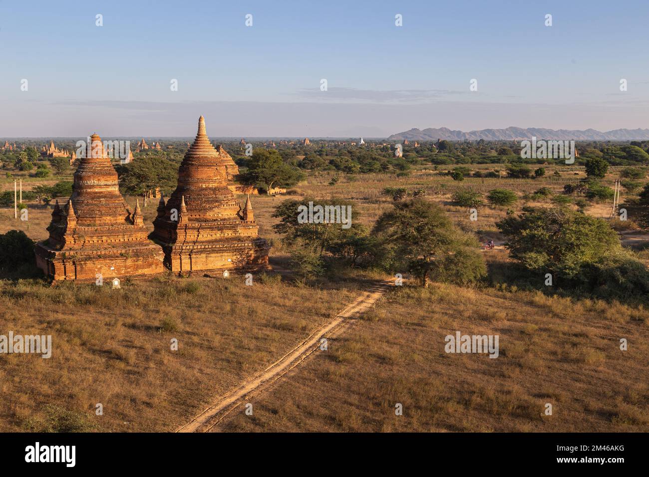 Two small temples stand amongst many others on the Bagan Plains of ...