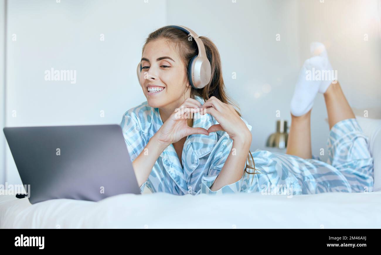 Woman, video call and heart hand sign of a person in the morning with ...