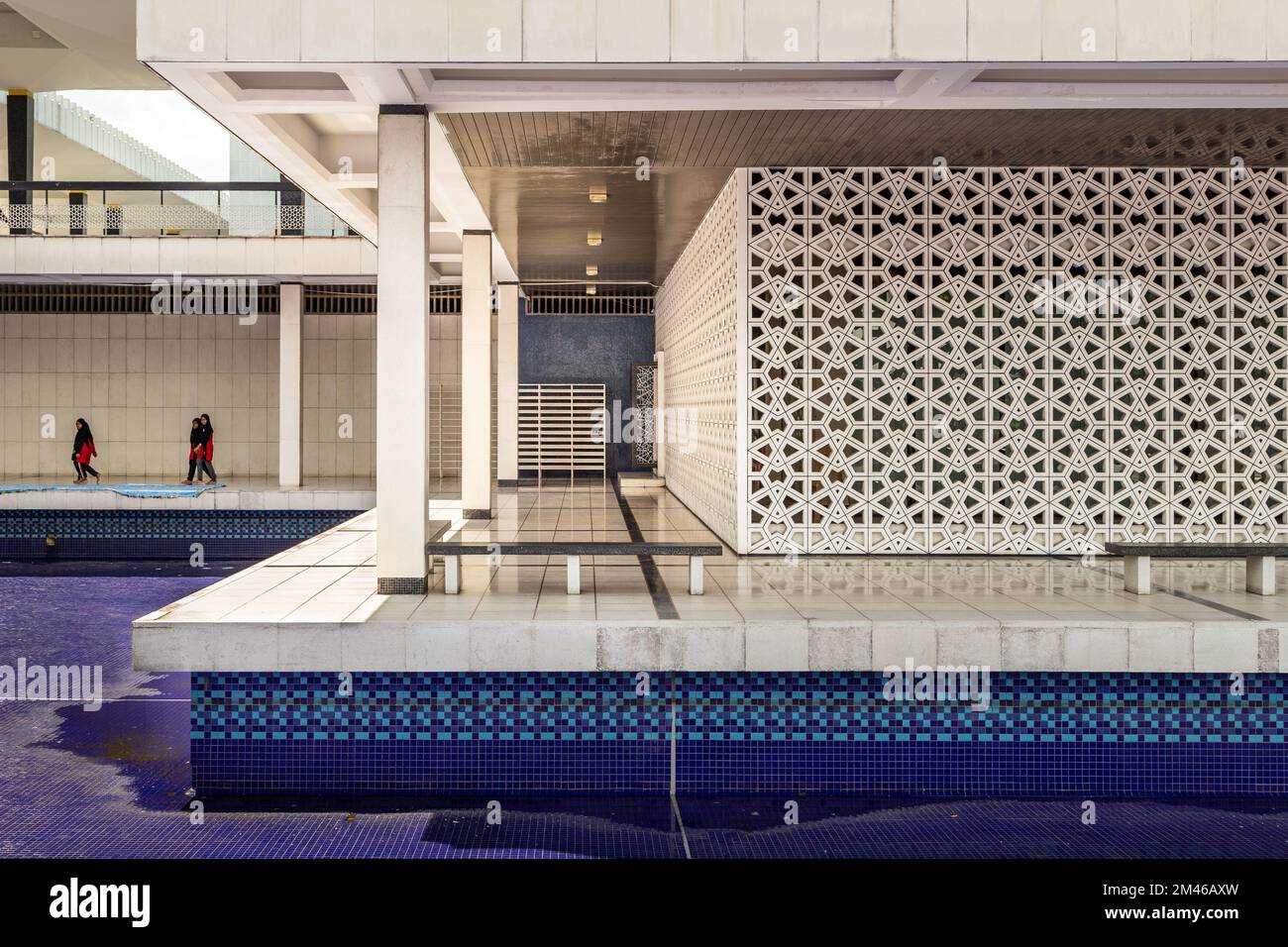 The walk along the open-air corridors of the National Mosque of ...