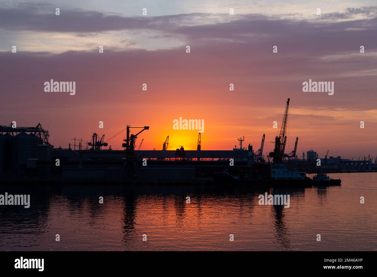sunset in industrial landscape of commercial seaport. Sunset at seaport ...