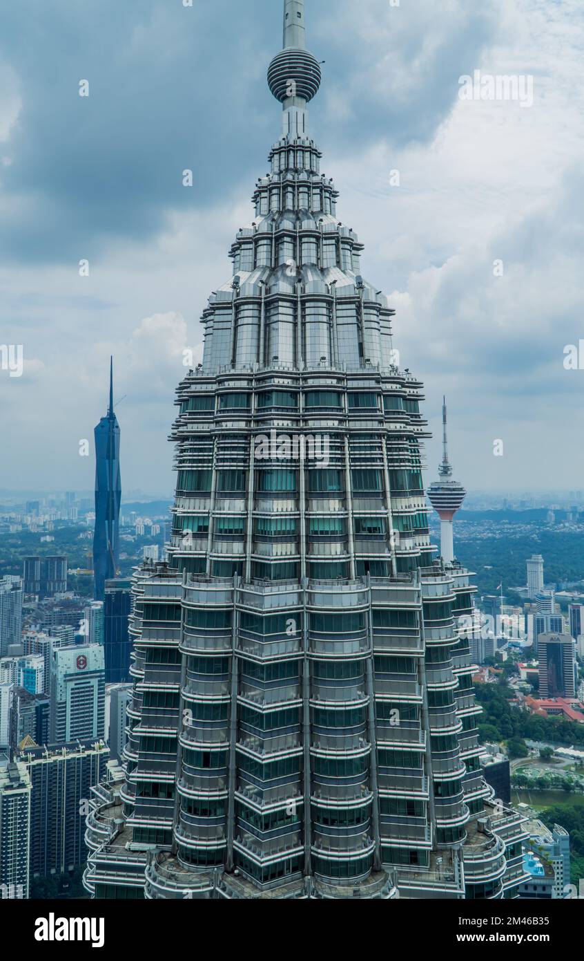 A vertical shot of the Petronas Twin Tower 2 against the KL Tower and ...