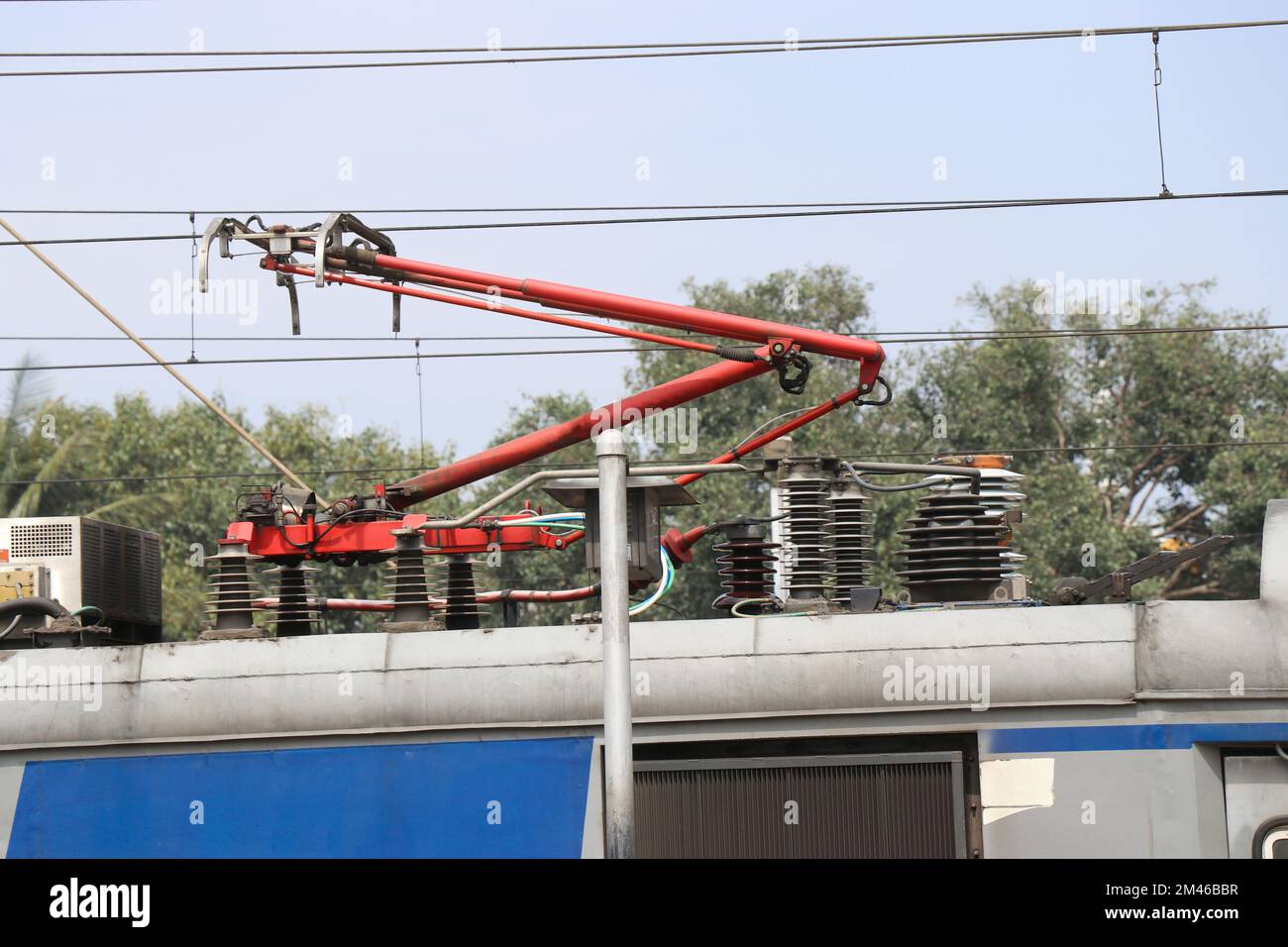 Electric railway trains with the pantograph system connecting with overhead electric lines and a ...