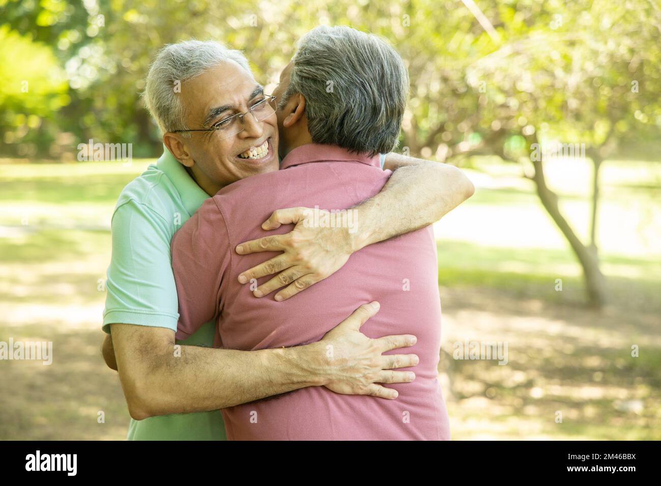 Happy senior indian men hugging each other, Mature aged old friends ...