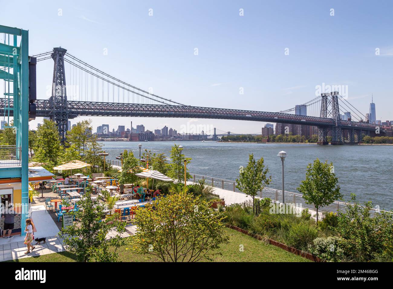 View of the Williamsburg Bridge and lower Manhattan skyline from Domino Park in Williamsburg ...