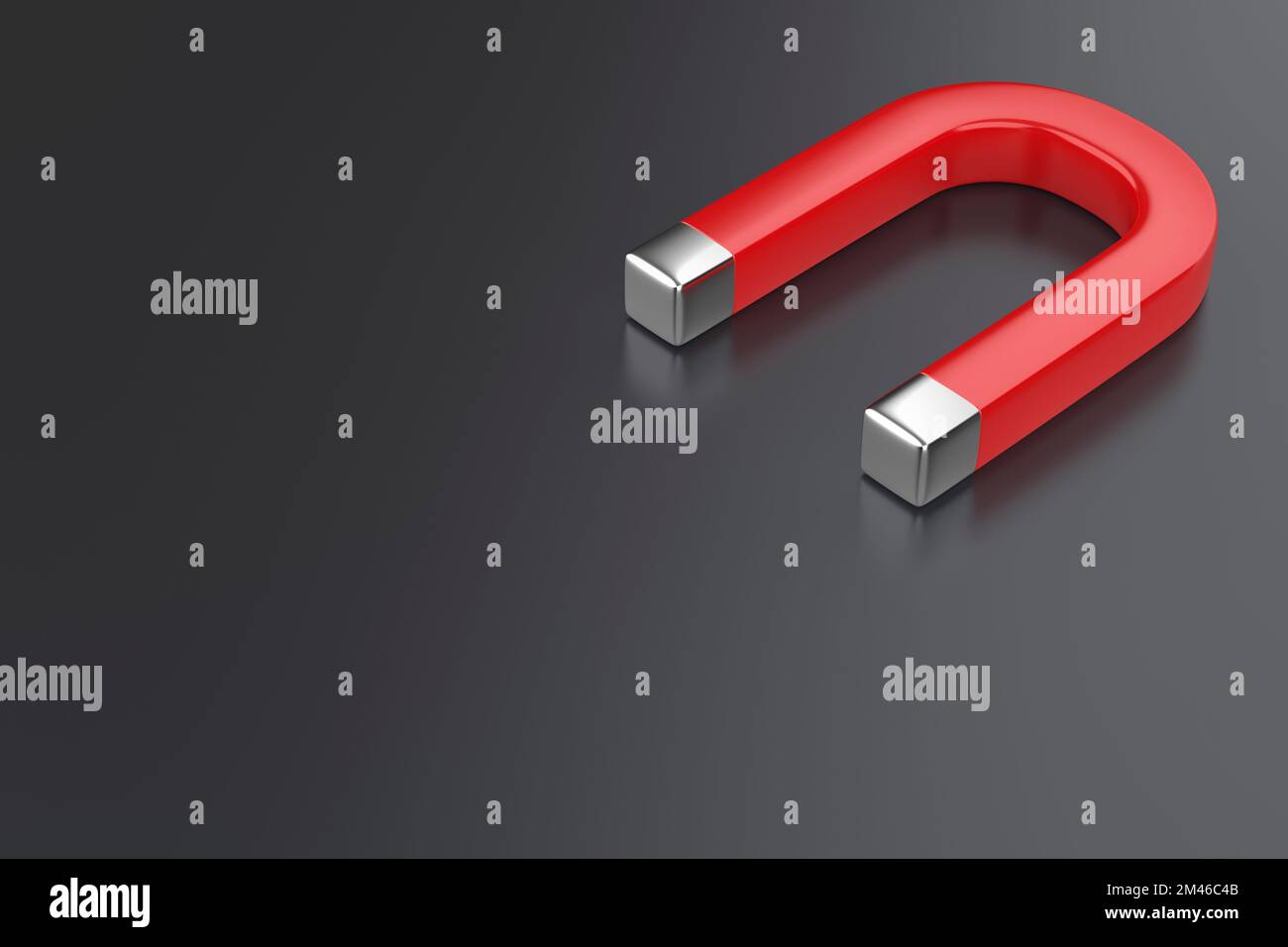 Red horseshoe magnet on dark grey background Stock Photo - Alamy