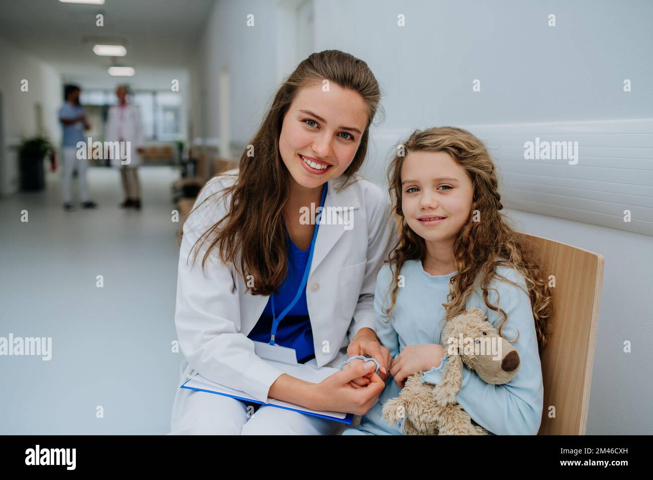 Portrait of young doctor with his little patient at pediatrics Stock ...