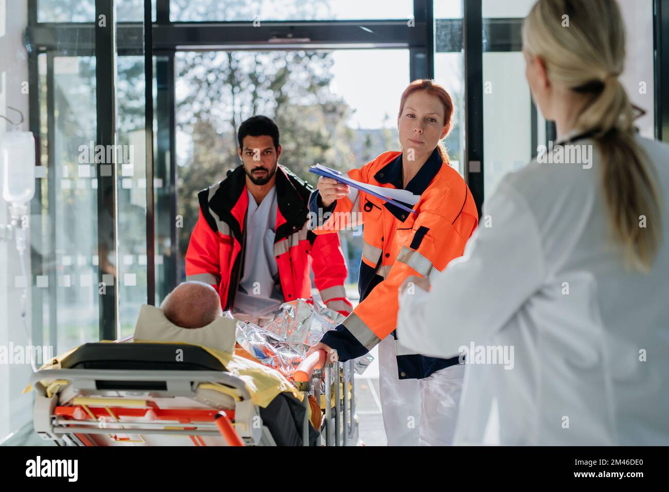Rescuers bringing patient with serious injury to hospital Stock Photo ...