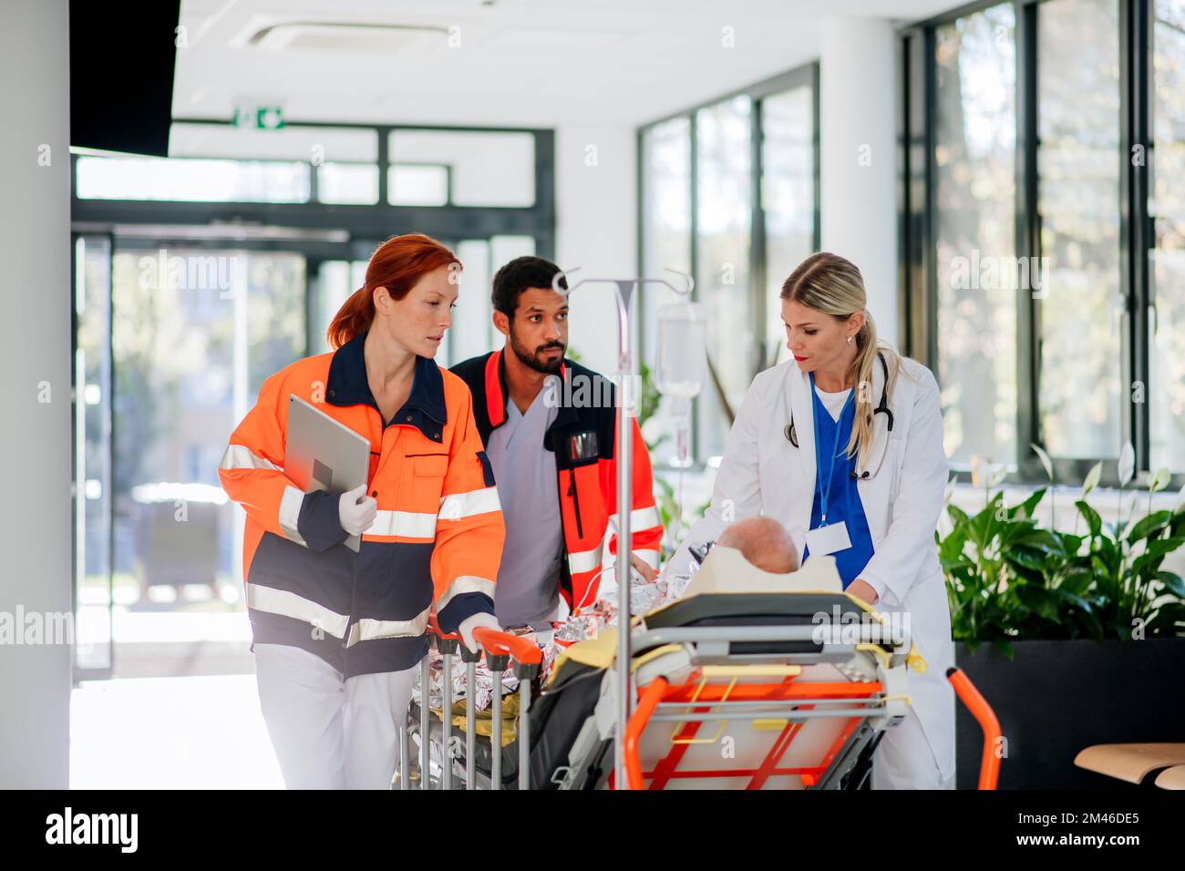 Young woman doctor taking care of patient from rescue ambulance Stock ...