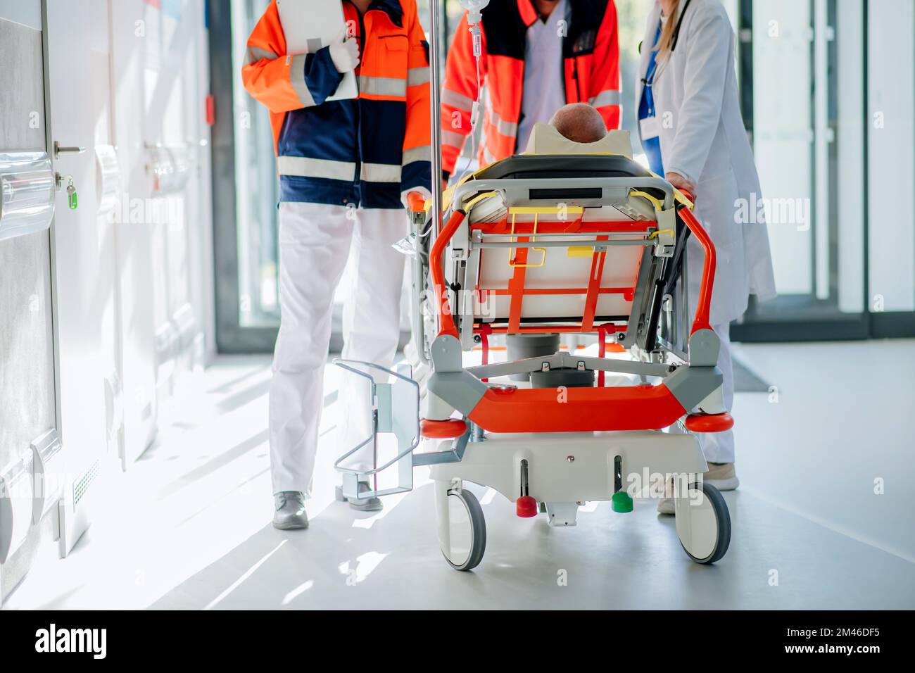 Rescuers bringing patient with serious injury to hospital Stock Photo ...