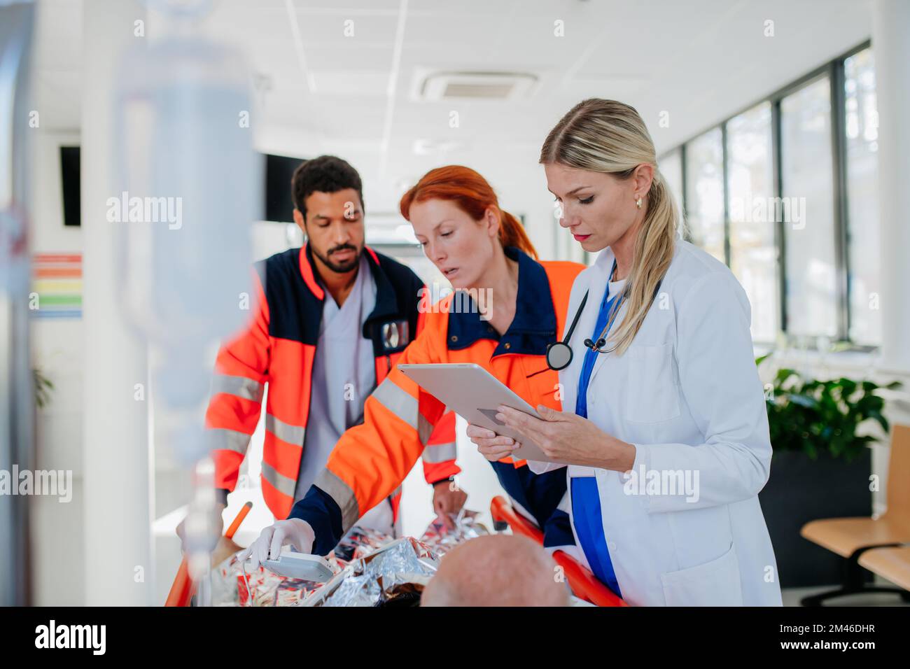 Young woman doctor taking care of patient from rescue ambulance Stock ...