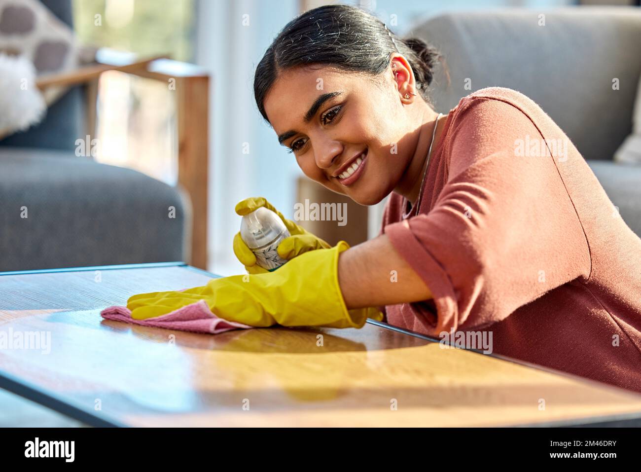 Woman, wipe table and spray with cloth, for hygiene and disinfectant in ...