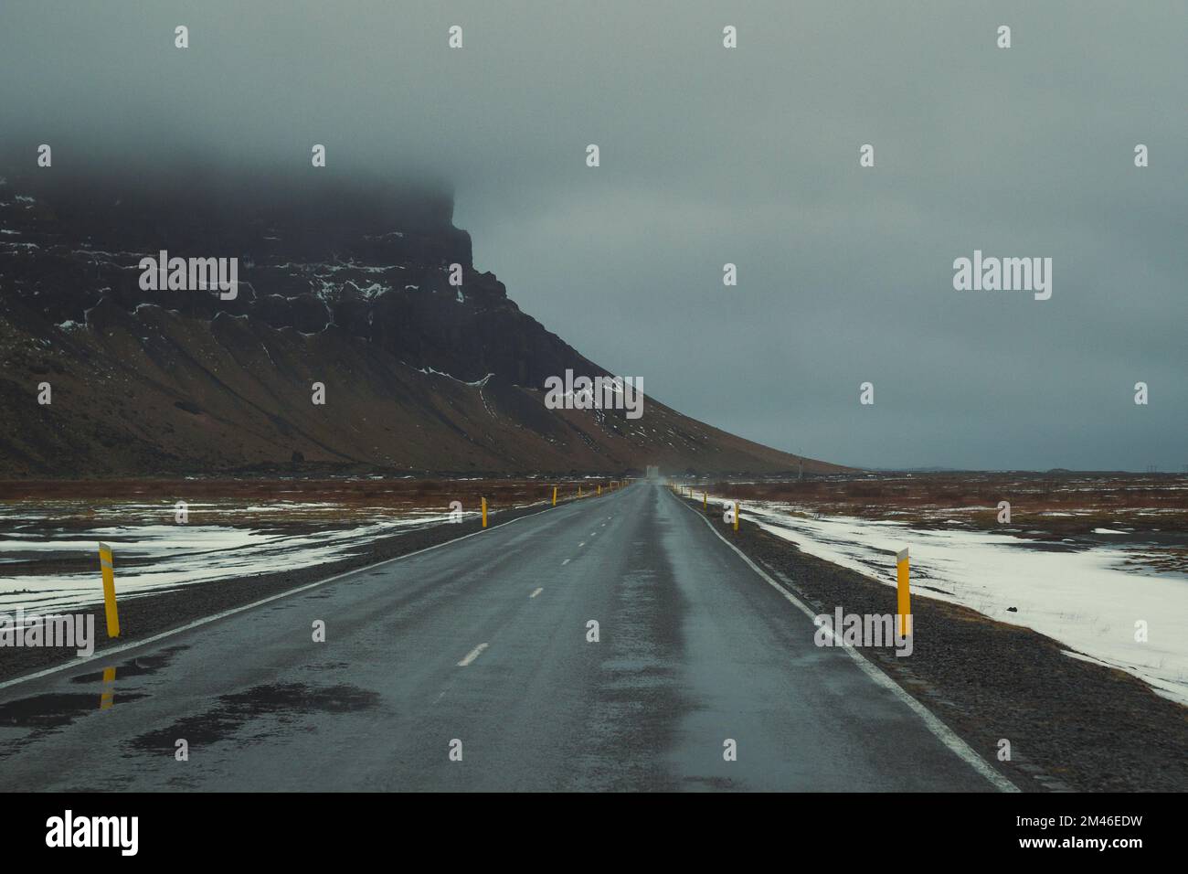 Highway across snowy field landscape photo Stock Photo - Alamy