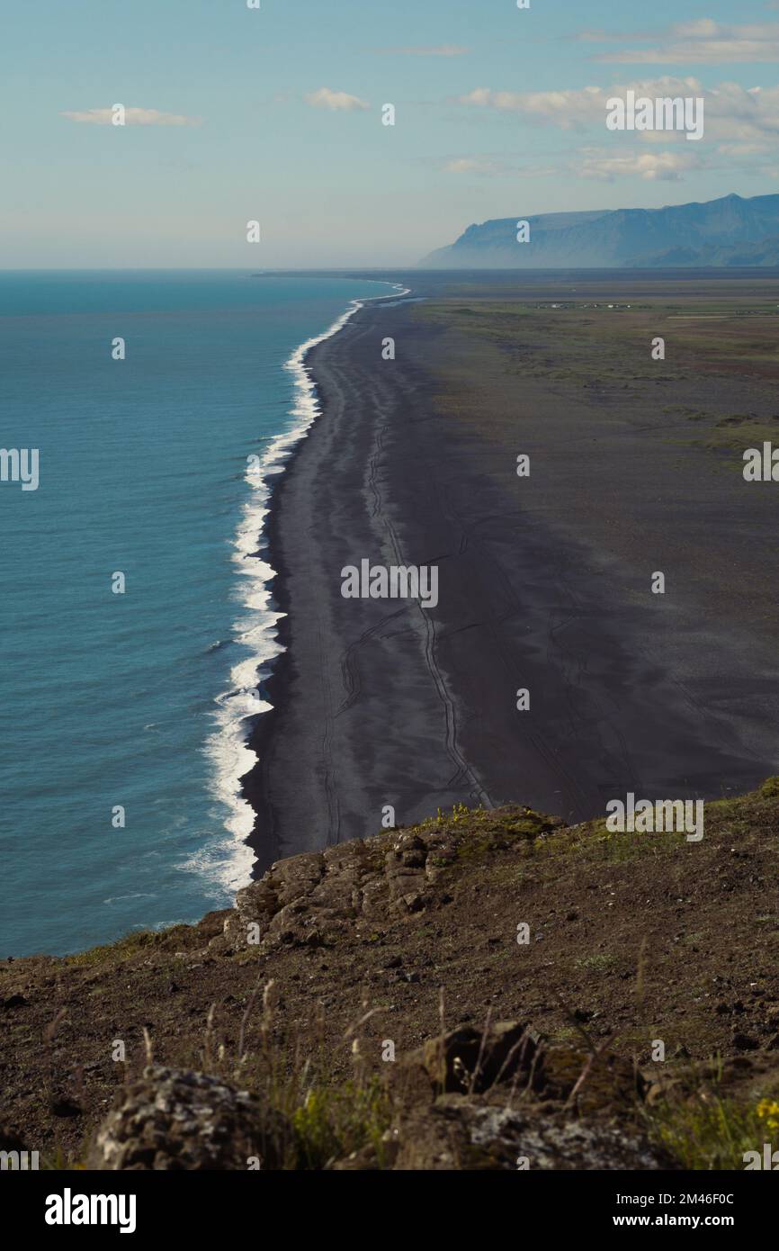 Empty beach with basalt sand landscape photo Stock Photo - Alamy