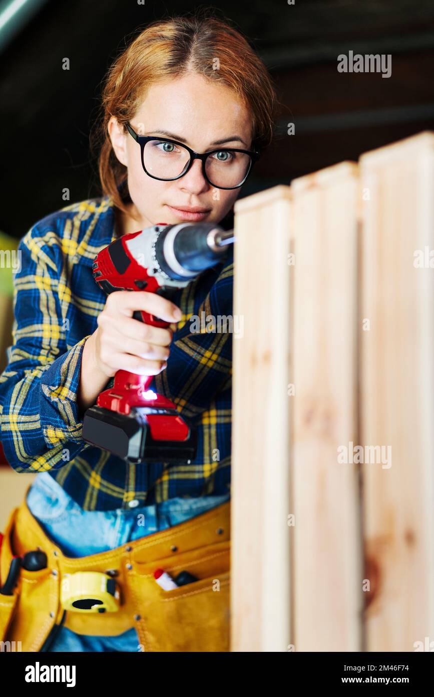 Woman tools drill hi-res stock photography and images - Alamy