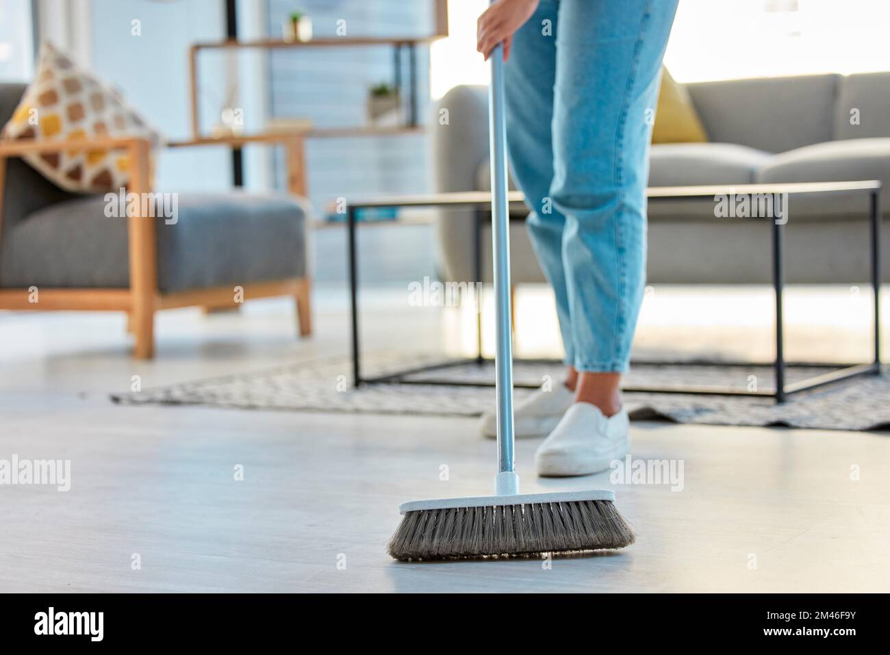 Cleaning, woman with broom and sweeping living room dirty floor and ...