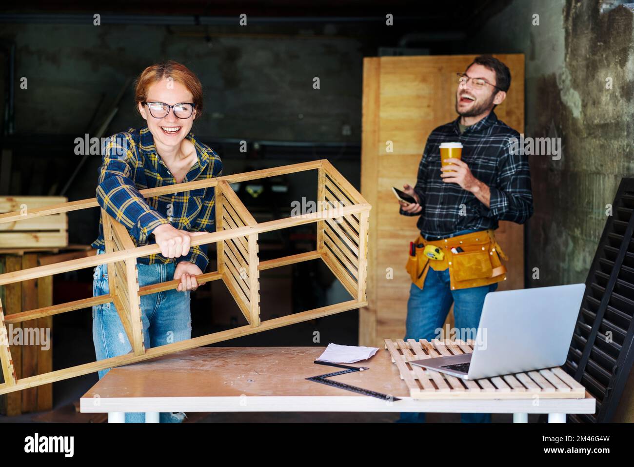 Husband and wife having fun together while working in their family ...