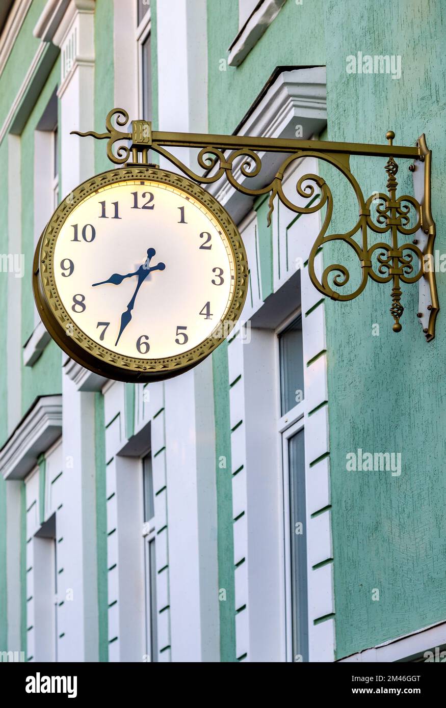 Clock hanging on building hi-res stock photography and images - Alamy