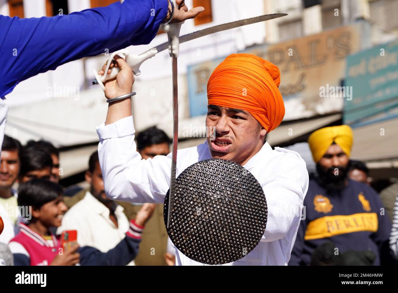 Indian Sikh demonstrates his traditional martial art skills during the ...