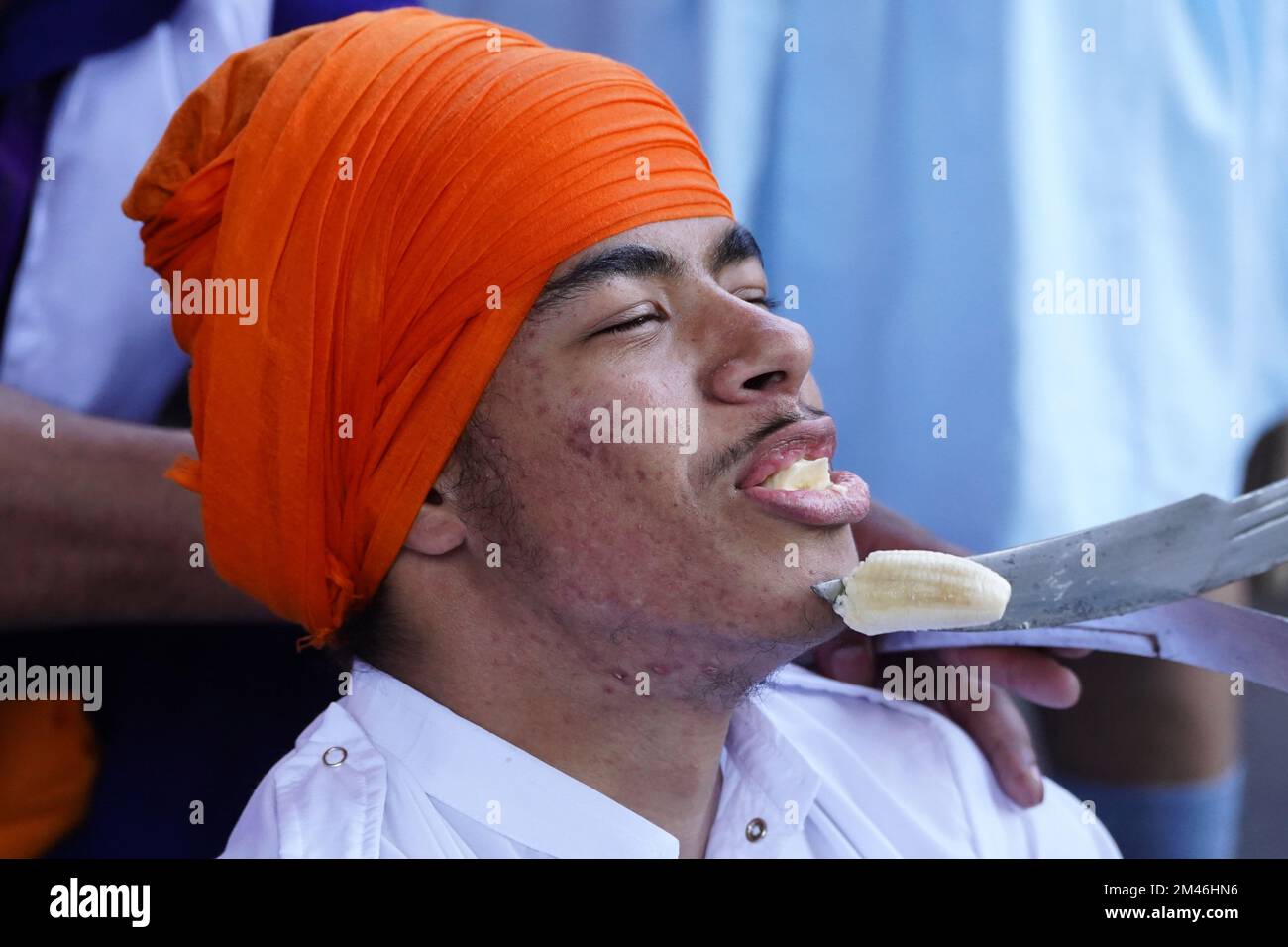 Indian Sikh demonstrates his traditional martial art skills during the ...