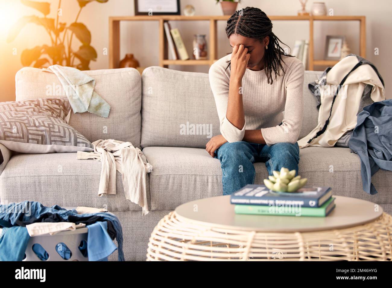 Black woman, stress and headache in depression on sofa from dirty ...